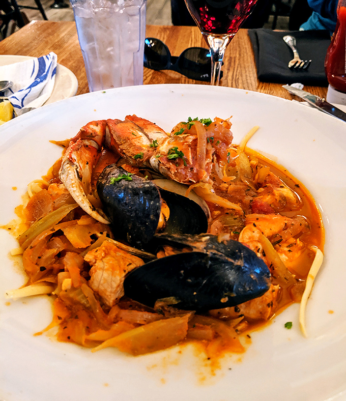 Cioppino: San Francisco's legendary seafood stew where mussels, shrimp, and fish throw the Bay Area's most delicious underwater party.