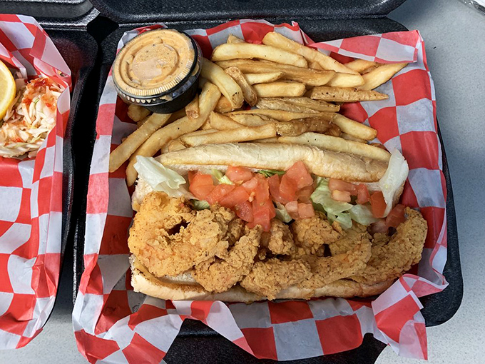 The shrimp po' boy that could convert vegetarians &ndash; overstuffed, unapologetic, and dressed to the nines with crispy companions.