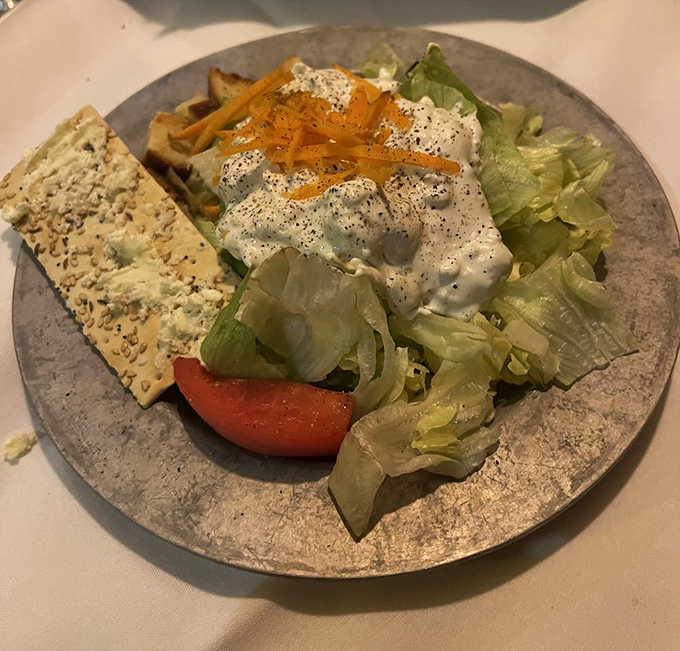 Even the salad gets the royal treatment. Crisp lettuce, fresh tomato, and house-made dressing prove that simple ingredients can sing when handled with respect.