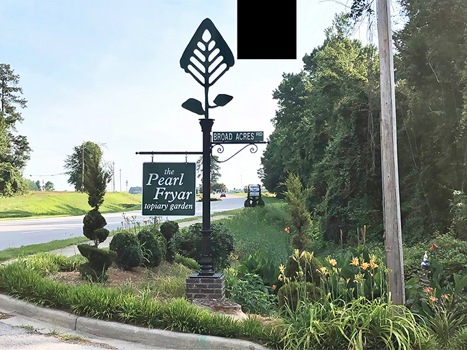 The elegant entrance sign stands as the garden's calling card. Even the marker itself features a topiary-inspired design that hints at wonders beyond.