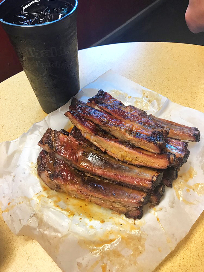 A slab of ribs with sweet tea&mdash;the kind of lunch that makes you reconsider your afternoon plans.