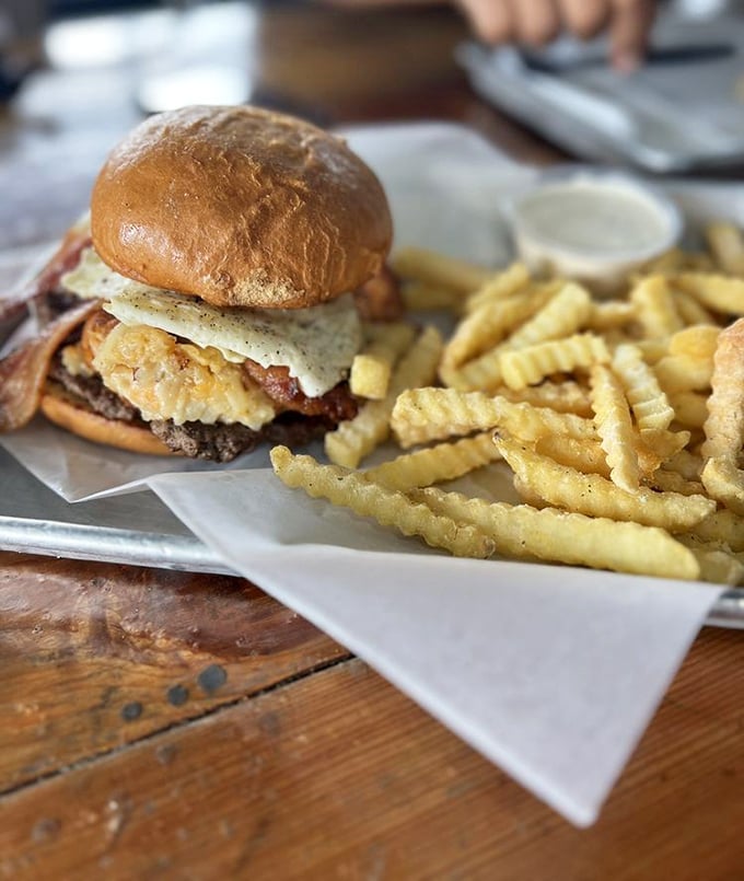 This isn't just a burger&mdash;it's an architectural marvel of beef, egg, and crispy something-or-other that makes your standard drive-thru look like child's play.
