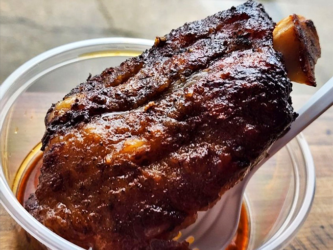 This glistening oxtail has been coaxed into tenderness through smoke and time – the kind of dish that makes you wonder why you've wasted time eating anything else.