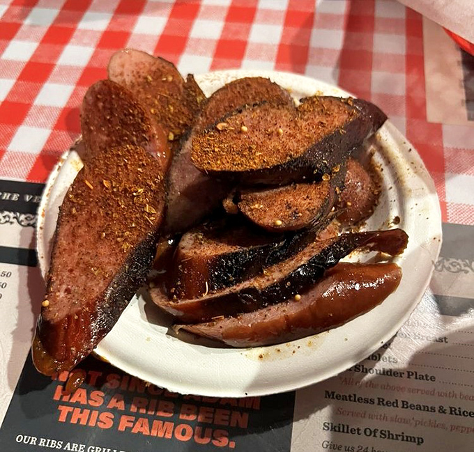 Smoked sausage with that distinctive reddish spice coating&mdash;a nod to the Greek-meets-Southern flavor profile that makes Memphis barbecue unique.