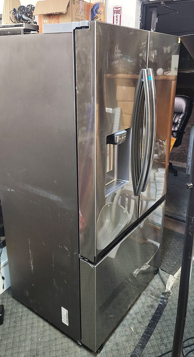 A stainless steel refrigerator waiting for its second act&mdash;perfect for the garage beer fridge or storing enough food for hurricane season.