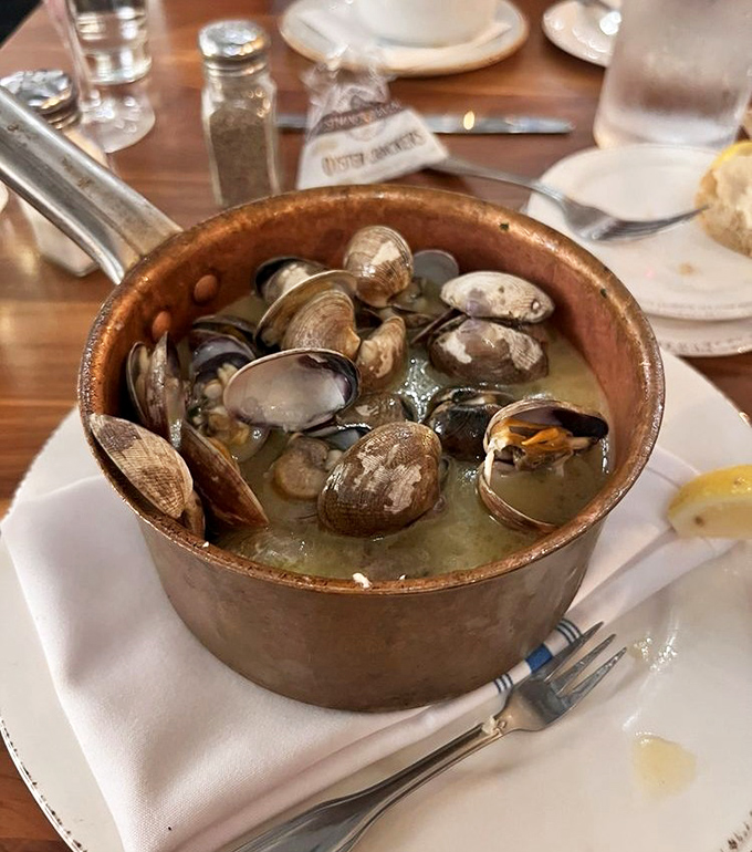Steamed clams swimming in garlicky broth&mdash;a copper pot of treasures from the deep. Each shell opens to reveal tender morsels worth savoring.