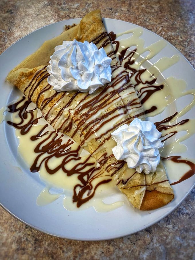 These crepes are dressed for success with strawberries, bananas, and enough chocolate drizzle to make you forget you're technically still at breakfast.