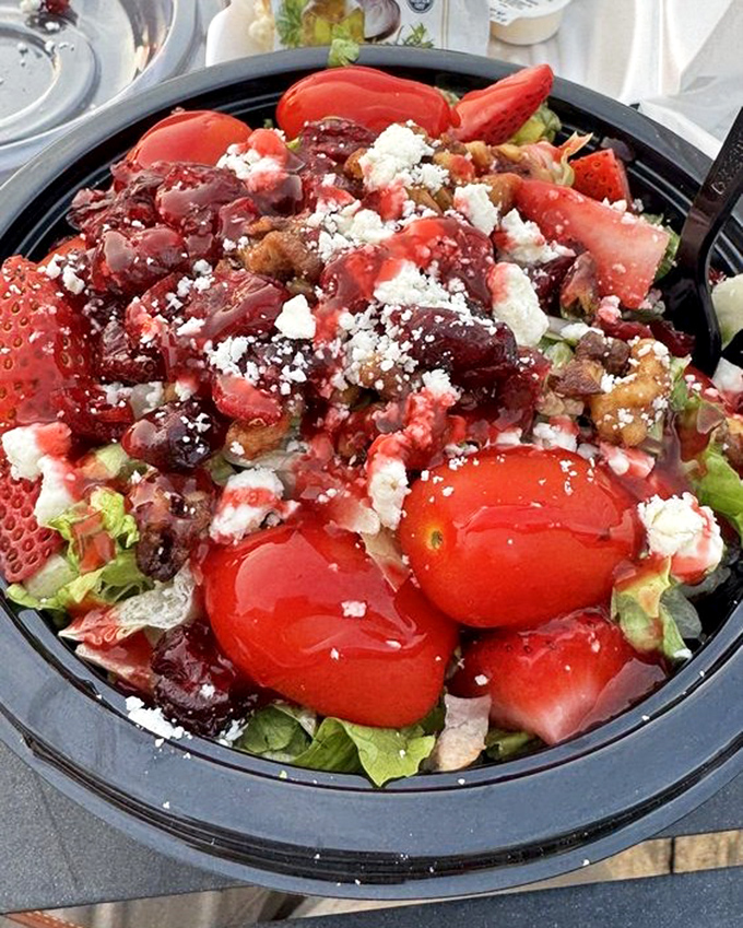 A vibrant strawberry pecan salad that proves seafood joints can do more than fry. Those feta crumbles are playing the perfect supporting role.