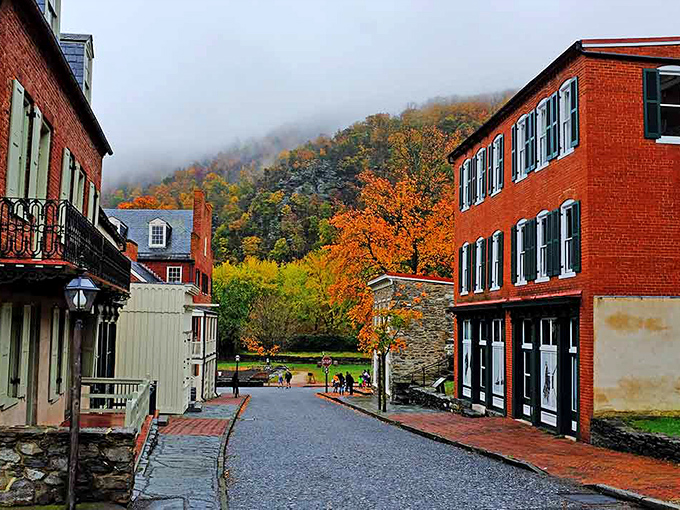 Misty mountains cradle historic streets in autumn's embrace, creating a scene so perfectly seasonal it could be fall's official publicity photo.