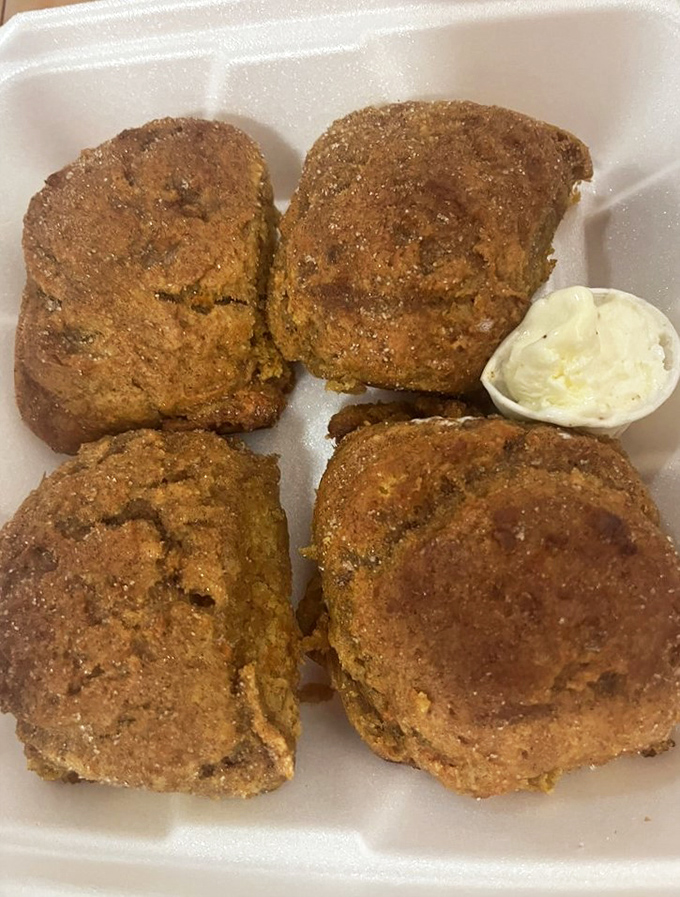 Sweet potato biscuits with a golden-brown crust that would make any Southern grandmother nod in approval, served with a side of butter.
