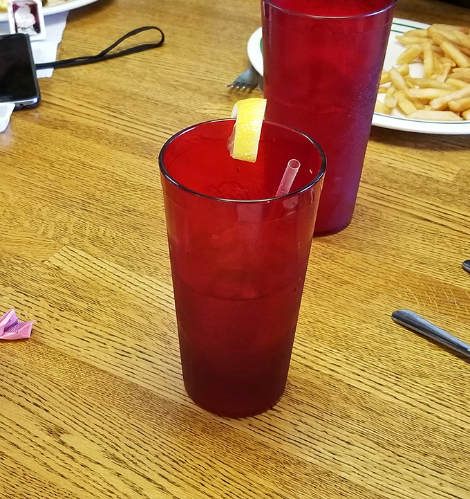 Sweet tea so perfectly balanced it could broker peace treaties. The ruby-red nectar of the South, complete with lemon life raft.