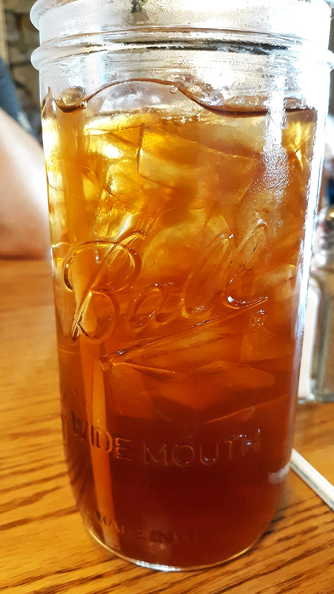 Sweet tea in a mason jar &ndash; because in Tennessee, this amber nectar flows freely and tastes like liquid Southern hospitality.