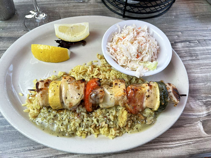 Swordfish kabobs resting on a bed of rice &ndash; proof that not everything delicious from the ocean needs to be fried or covered in butter.