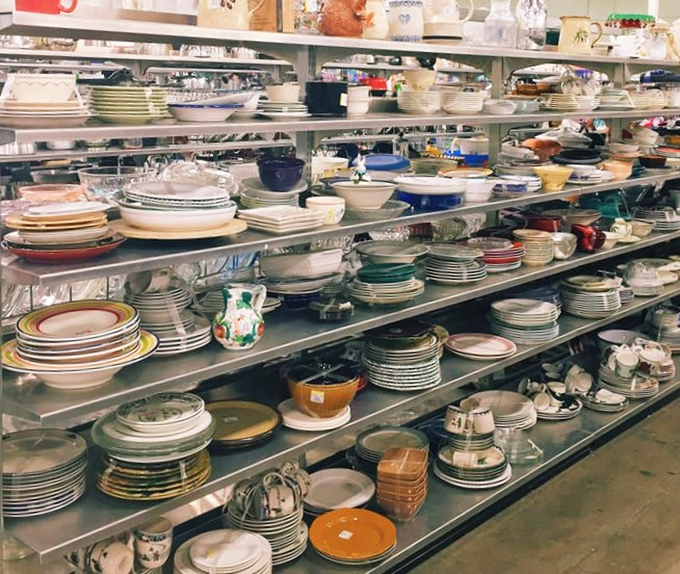 Dish paradise where incomplete sets find new purpose and vintage Pyrex patterns whisper tales of potlucks past.