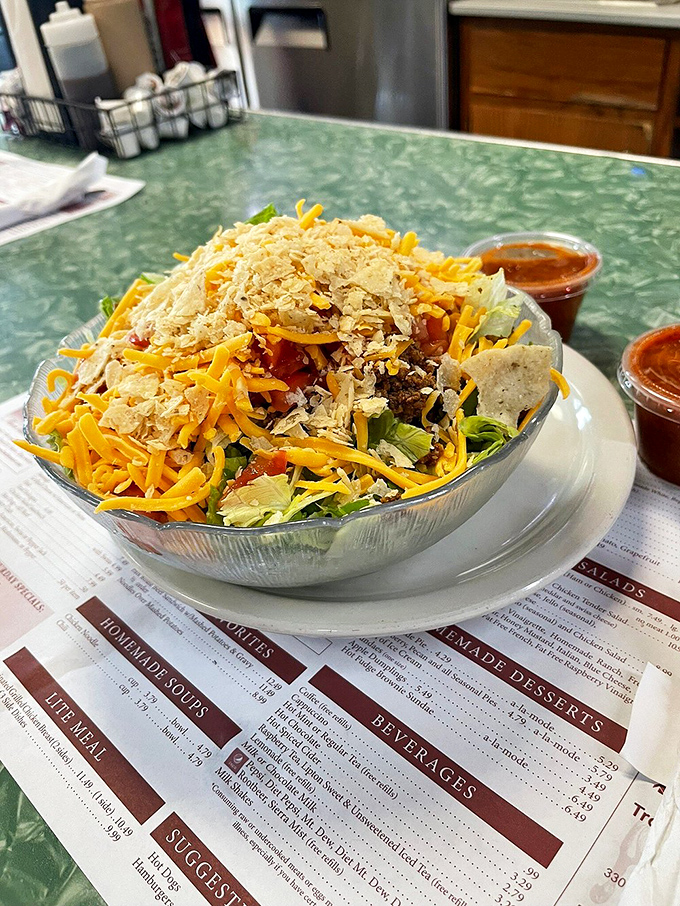 A taco salad that doesn't apologize for its Midwestern interpretation&mdash;cheese abundant, crispy shell intact, and absolutely delicious.