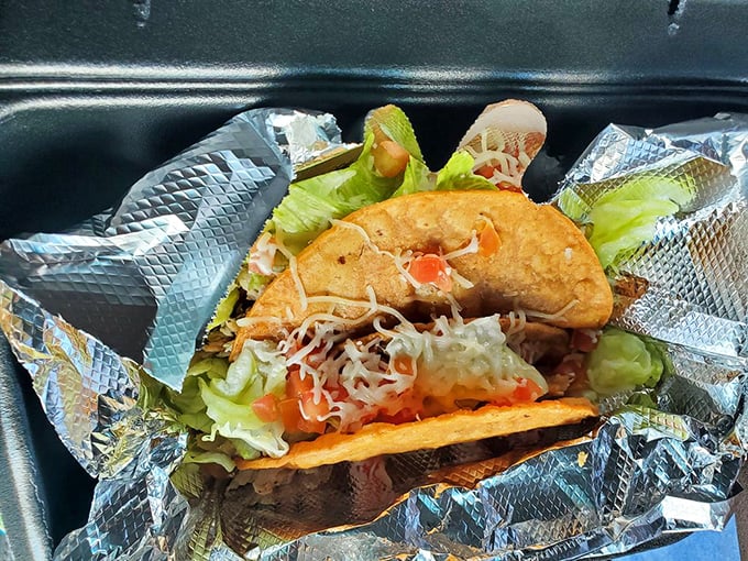 Crispy shells cradle a fiesta of fresh toppings – proof that sometimes the best things in life come in crunchy, handheld packages.