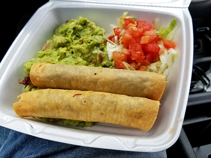 Golden, crispy taquitos flanked by guacamole and pico de gallo – a handheld fiesta that makes you forget about utensils entirely.