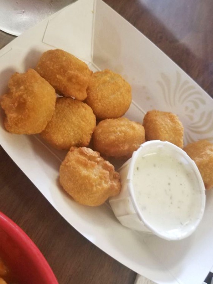 Those cheese curds look like little golden nuggets of Wisconsin's finest export, ready for dipping.