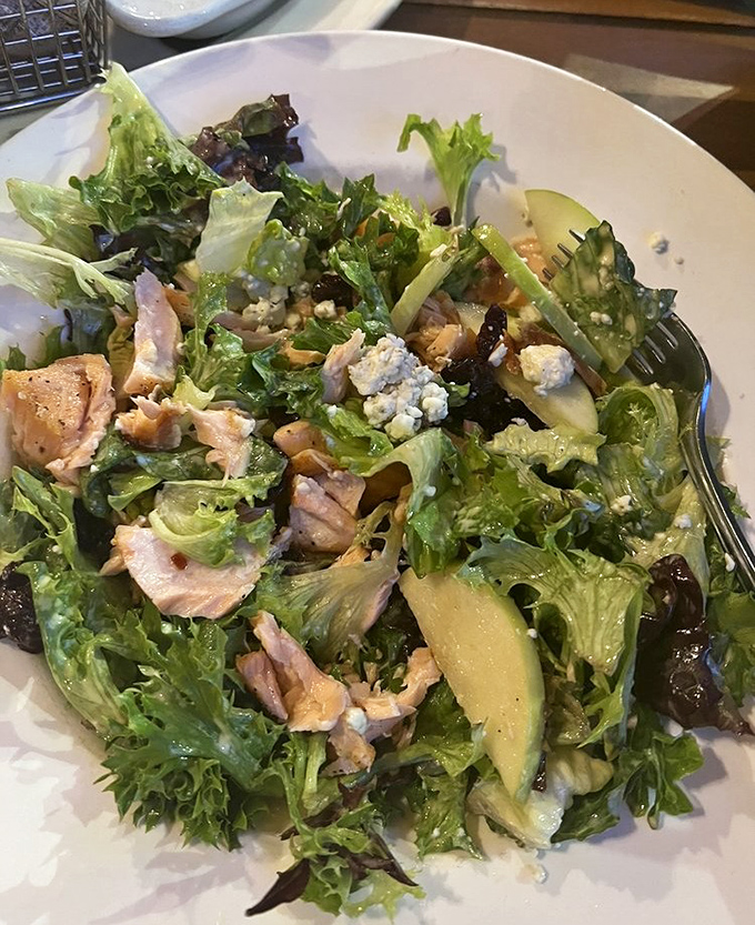 Fresh greens topped with salmon prove that even salads can be absolutely swoon-worthy at Nicholson's.