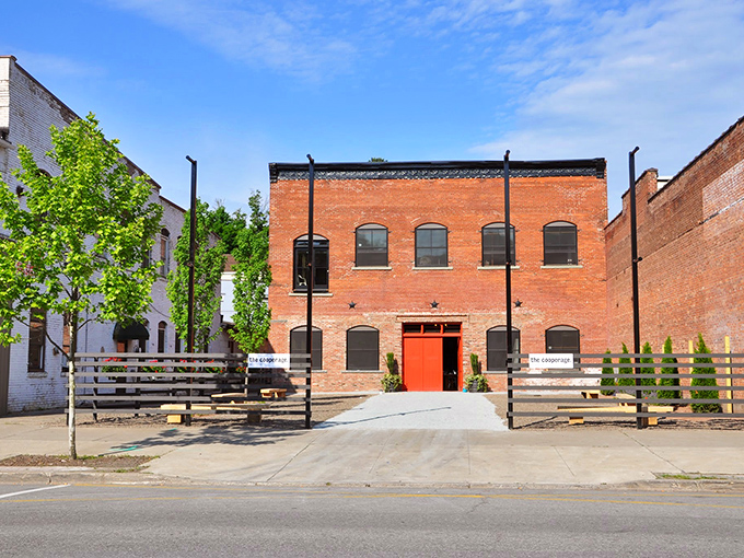 This brick building with its bright orange door isn't playing hard to get&mdash;it's just making sure you notice what could become your new favorite spot.