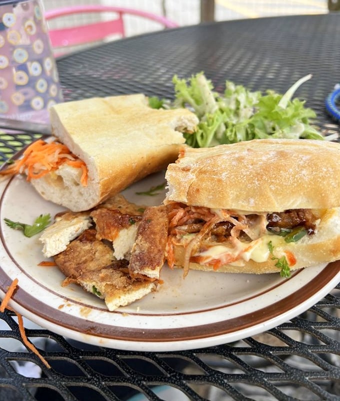 The banh mi that launched a thousand return visits. Crispy bread, perfectly seasoned fillings, and a side salad that's actually worth eating.