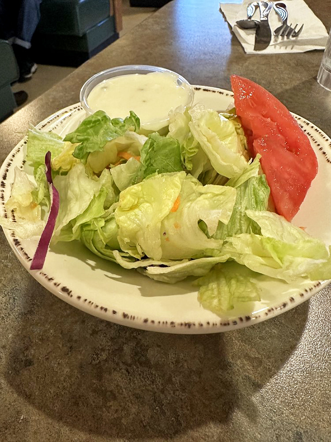 Even the side salad gets respect here. Fresh, crisp, and ready to balance out whatever comfort food indulgence you've chosen as your main.