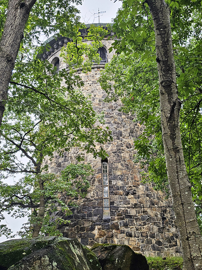 Playing peek-a-boo through spring foliage, the tower seems to be hiding—a 115-foot game of hide-and-seek that the landmark inevitably loses.