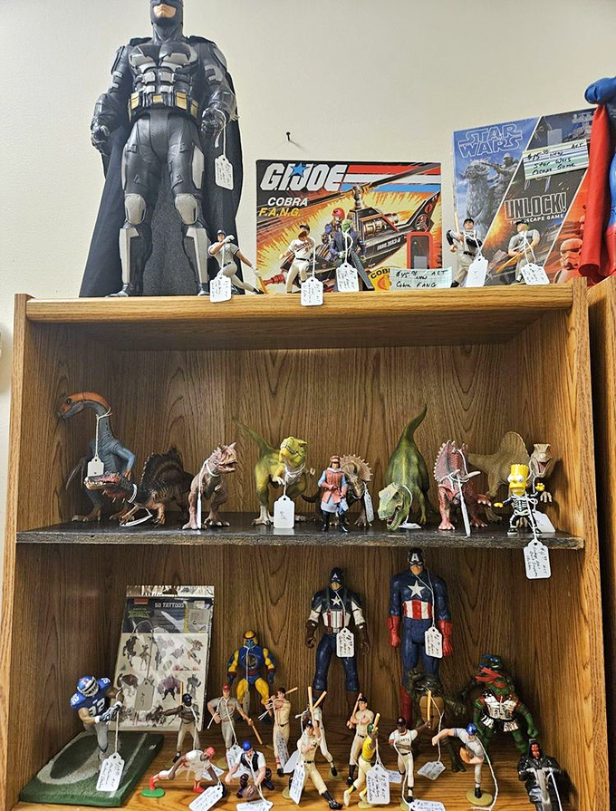 Superhero figures stand guard over dinosaurs and action heroes. Batman doesn't seem concerned about sharing shelf space with Captain America&mdash;a crossover we all wanted!