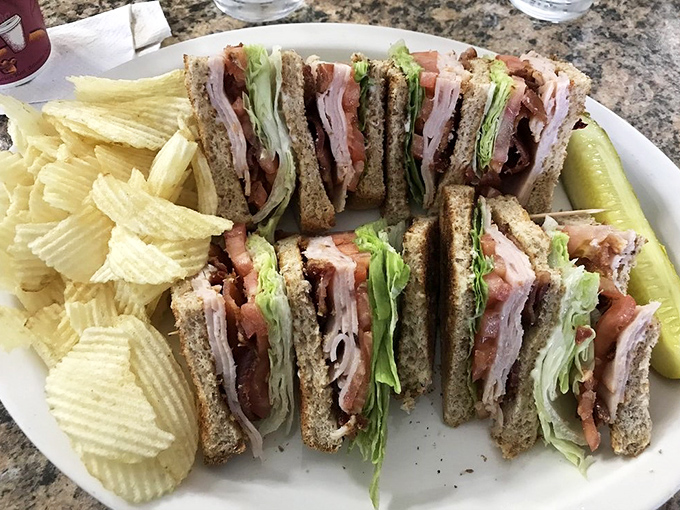 A proper club sandwich should require jaw unhinging abilities. This one passes the test with flying, delicious colors.