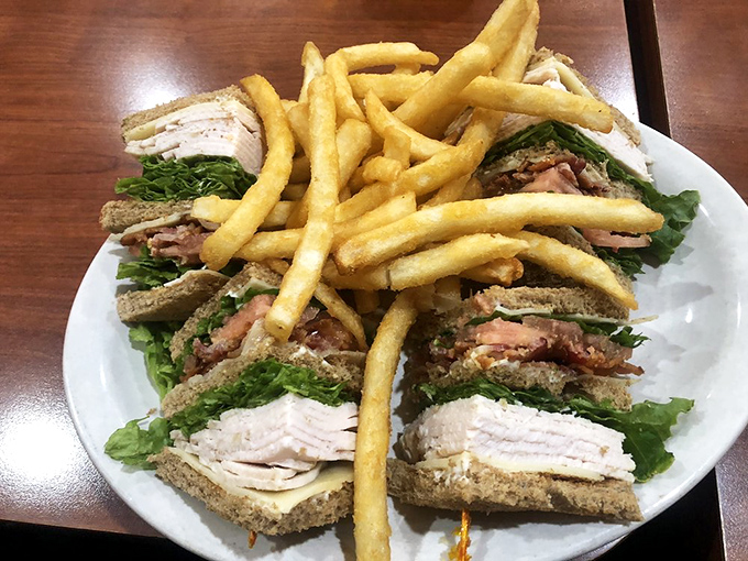 The club sandwich: architectural marvel of the diner world. Three stories of deliciousness held together with toothpick engineering.