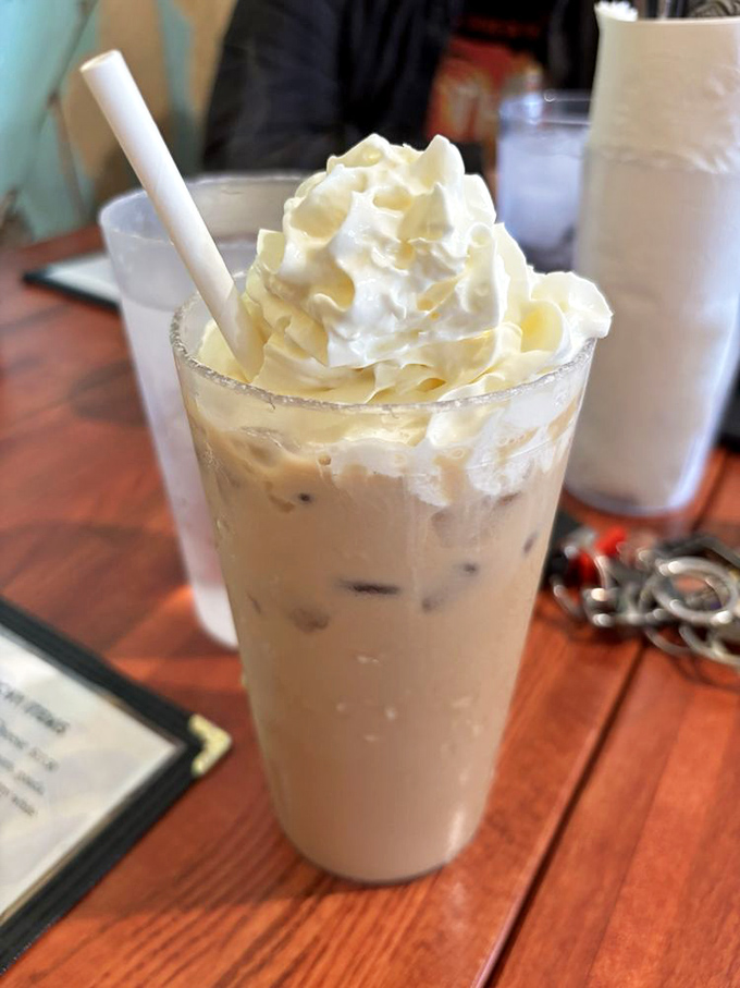 That iced coffee isn't just a beverage&mdash;it's a dessert in disguise, with whipped cream so generous it deserves its own thank-you note.