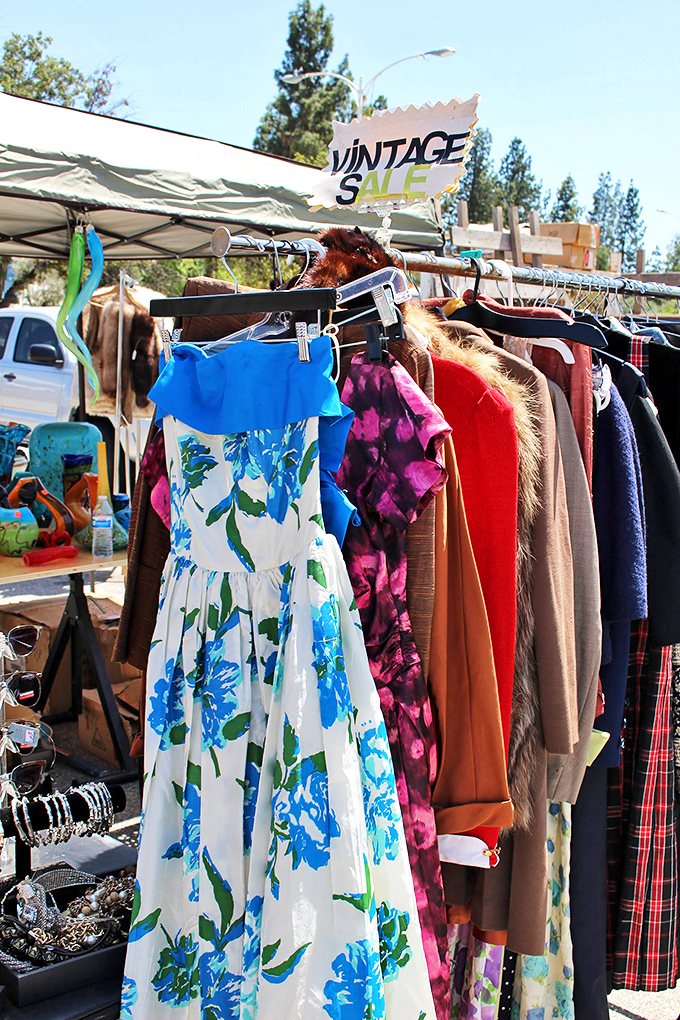 Fashion time travel on a single rack. That blue floral dress isn't vintage &ndash; it's a portal to summers of decades past.