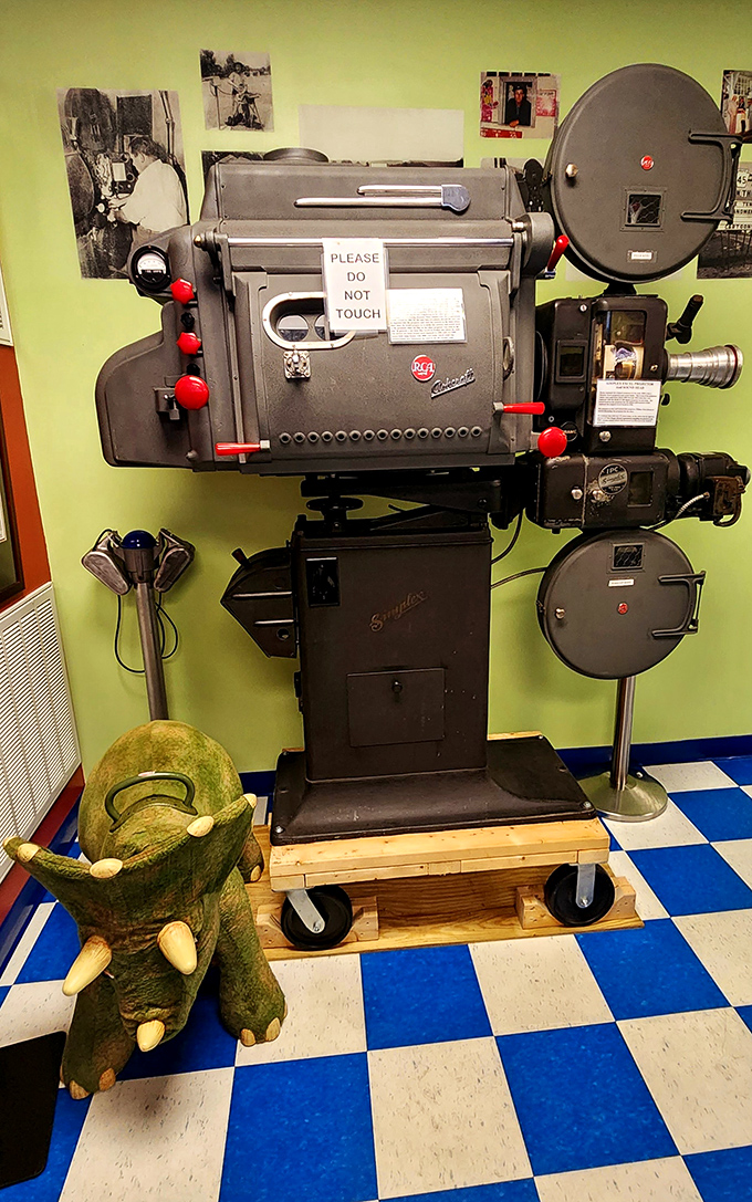 This vintage projector, now retired from active duty, reminds us that movie magic once required serious mechanical muscle.