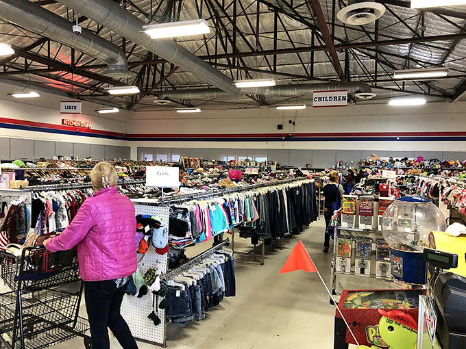 The children's section bustles with activity—proof that smart parents know kids outgrow clothes faster than you can say "growth spurt."