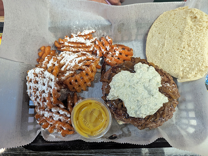 Waffle fries dusted with powdered sugar alongside a burger topped with what appears to be blue cheese &ndash; Jeff's isn't afraid to play with contrasting flavors.