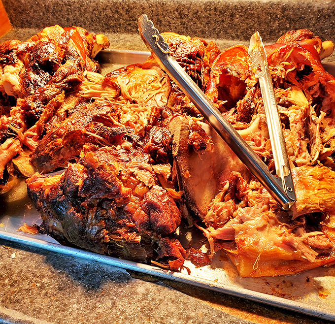 Behold the star of the show &ndash; slow-smoked pork that's been coaxed to perfection over hours, ready to make your taste buds stand at attention.