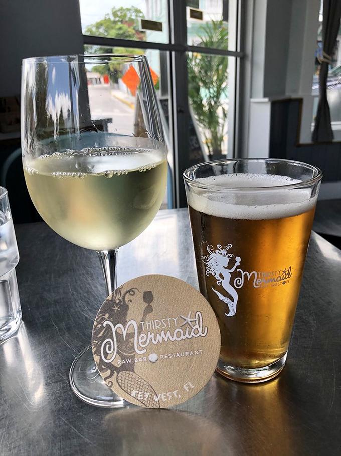 The perfect Florida afternoon: sunshine streaming through windows, cold beer in hand, and a wine glass that's definitely not staying full for long.