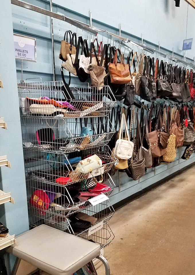 Handbag heaven! Designer dreams and practical purses hanging like fashionable fruit, ripe for the picking.