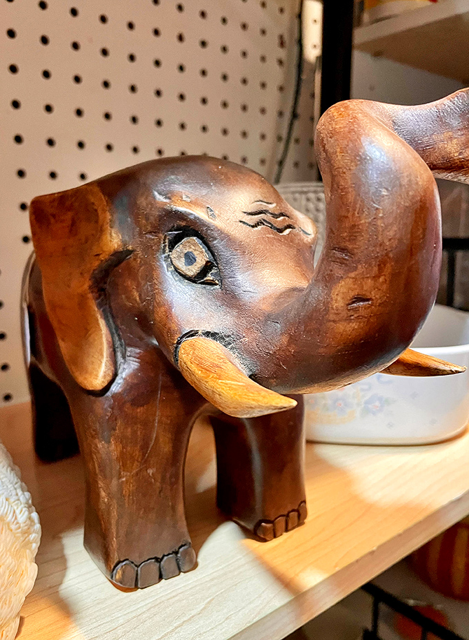 This hand-carved wooden elephant with its knowing eye seems to ask, "Are you the one taking me home today?"