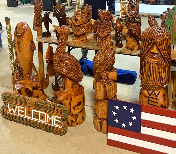 Wooden wildlife stands guard at this booth, where chainsaw artistry transforms ordinary logs into extraordinary forest creatures and welcome signs.