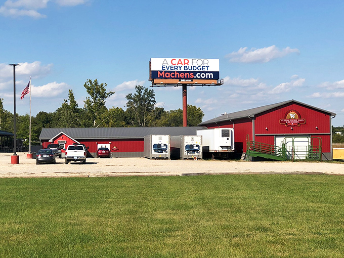 This red-roofed establishment stands ready to welcome hungry travelers. The American flag flies proudly above this roadside spot that promises hearty, no-nonsense fare.