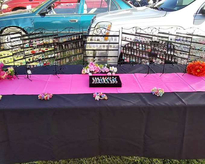 A kaleidoscope of earrings transforms a simple table into a jewelry store, each pair waiting to become someone's new favorite accessory.