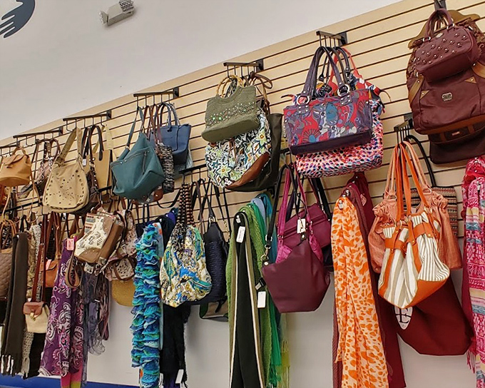 Handbag heaven! Designer-inspired purses in every color imaginable hang like exotic fruit ready for the picking.