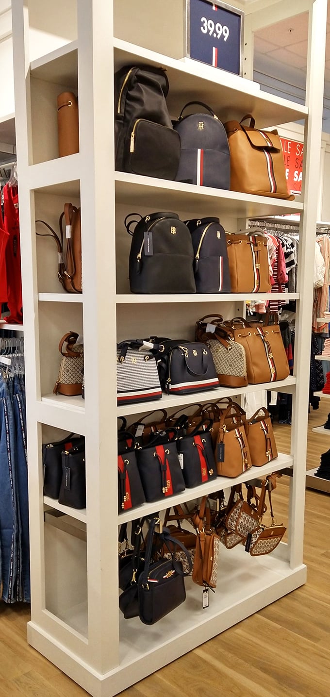 Designer handbags arranged like museum pieces. At these prices, you can finally own that Tommy Hilfiger bag without eating ramen for a month.