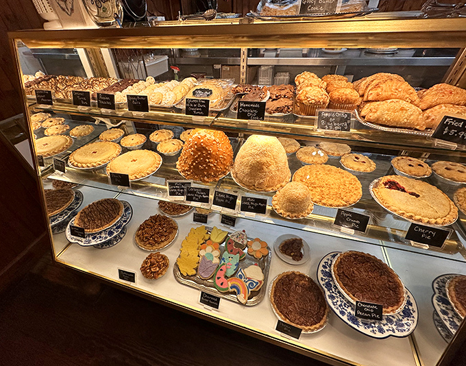 The bakery case at The Blue Owl isn't just a display—it's a museum of edible masterpieces where "I'll just look" becomes "I'll take one of each."