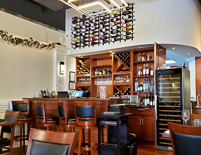 The bar isn't just stocked&mdash;it's curated, with a wine wall that makes selecting your bottle feel like choosing from a liquid library.