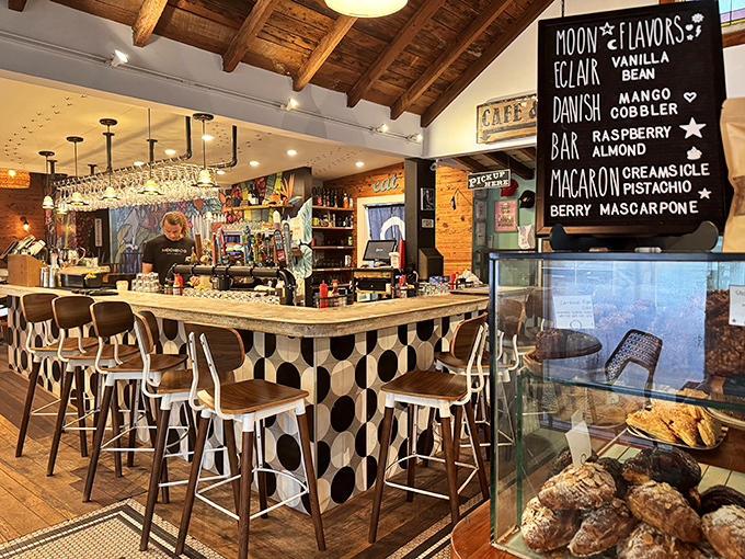 The bar area combines vintage charm with modern flair&mdash;note the playful black and white tile pattern that somehow works perfectly with the rustic wooden ceiling. 