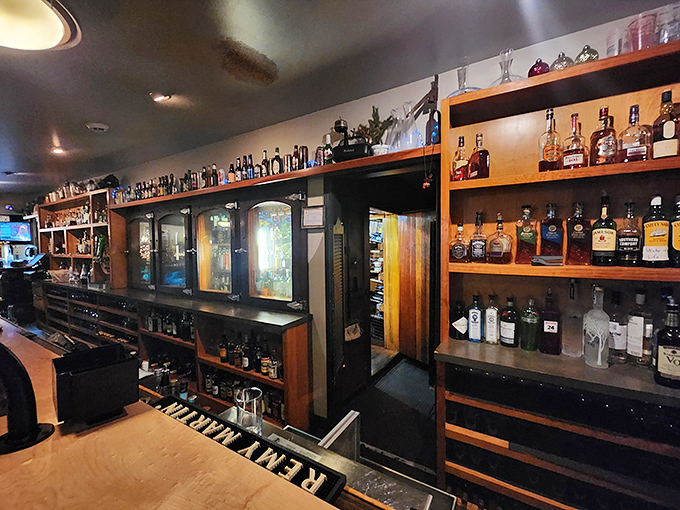 A well-stocked bar showcasing an impressive bourbon collection means your cocktail game is as strong as the steaks here.