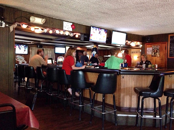 The bar area—where brandy old fashioneds are crafted with the precision of Swiss watchmakers and strangers become friends over tales of Packers glory.