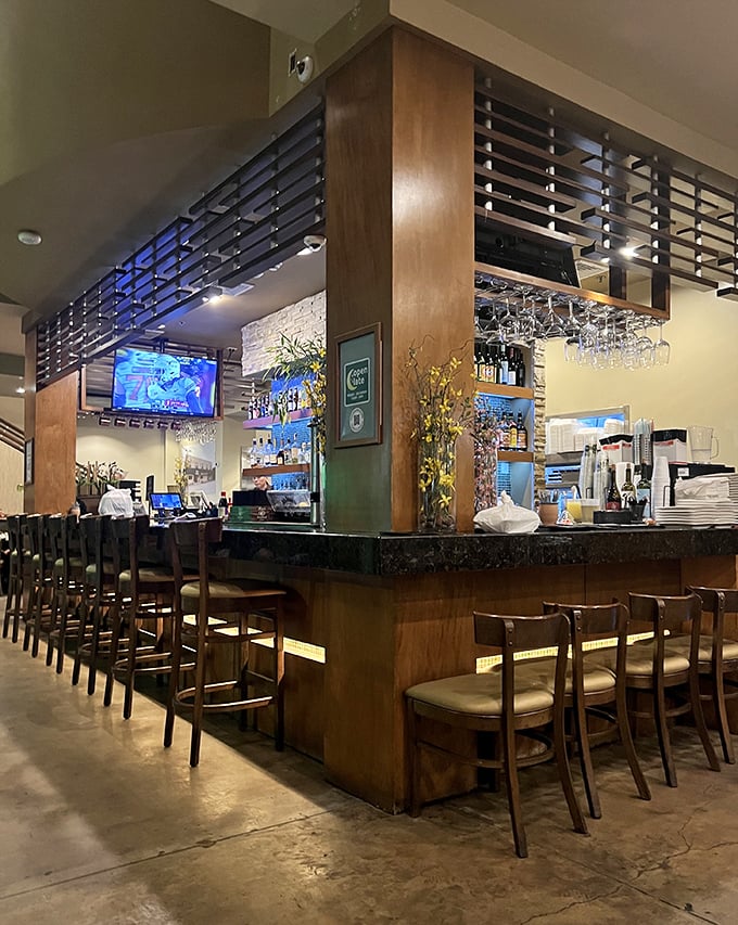 The bar area features thoughtful design and a full drink menu for those who like their crispy noodles with cocktails.